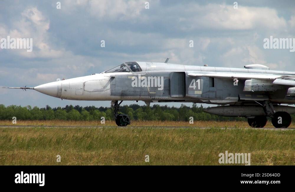 Su-24 Fencer) supersonic all-weather bomber moves along taxiway towards ...