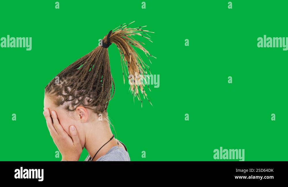 Girl covers her face as the swallows run away from her braids seeing a ...
