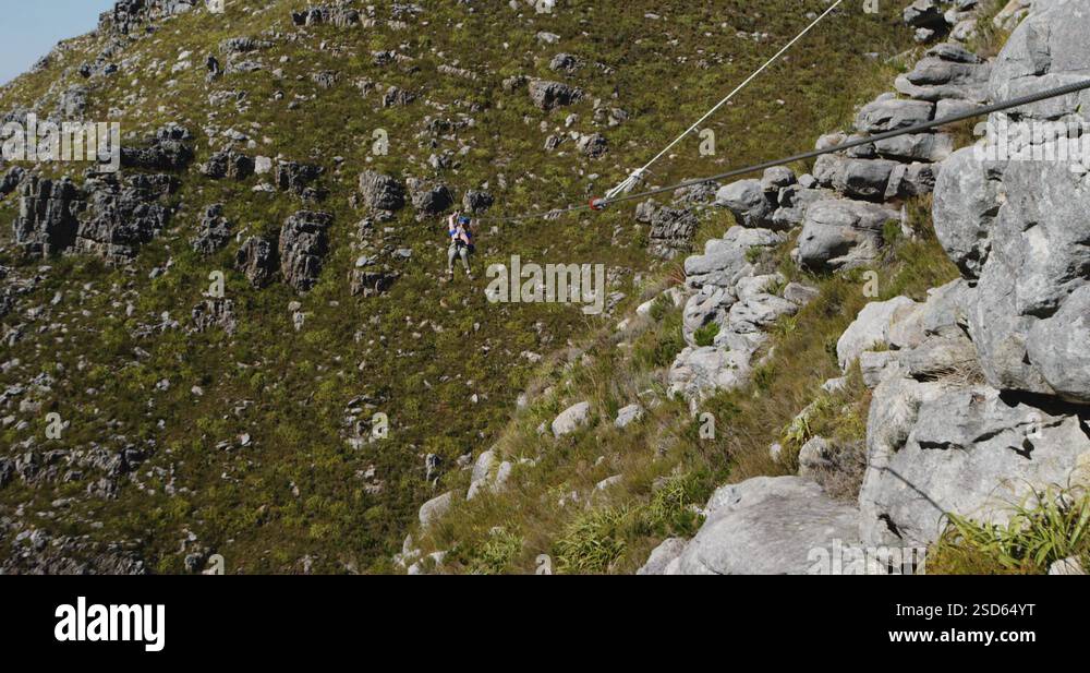 Young Caucasian woman zip lining Stock Video Footage - Alamy
