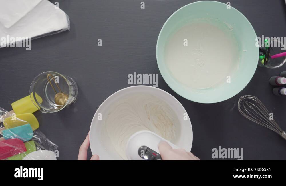 Preparing simple royal icing to decorate sugar cookies Stock Video ...