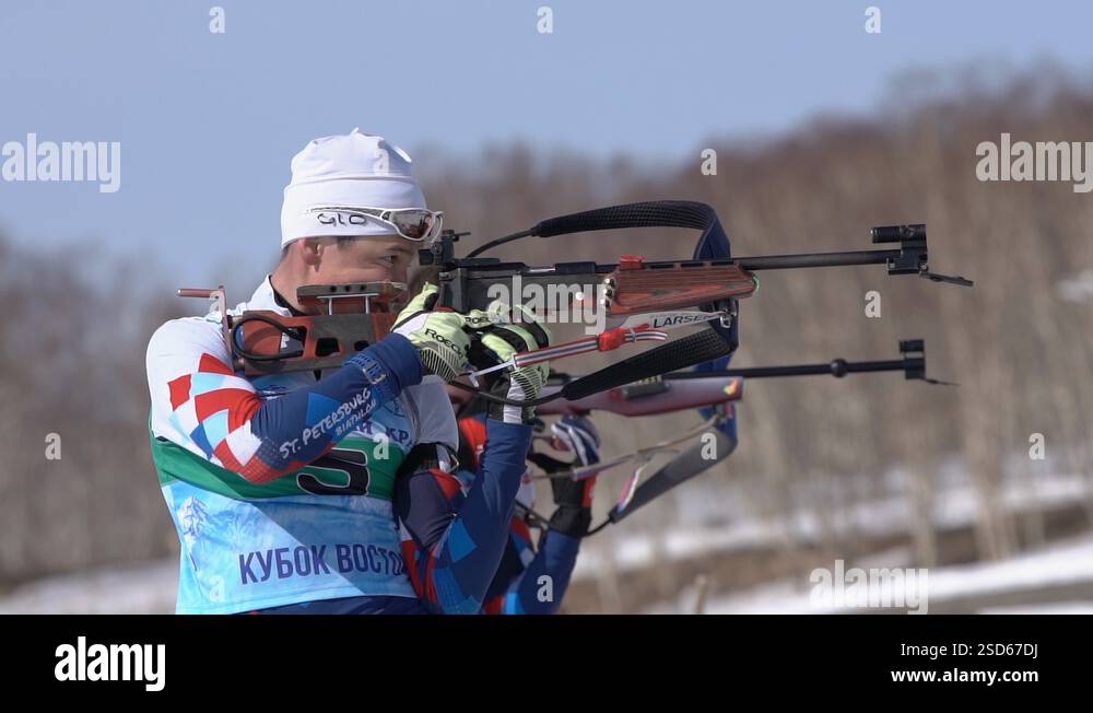 Junior biathlon competitions East Cup. Sportsman biathlete aiming ...