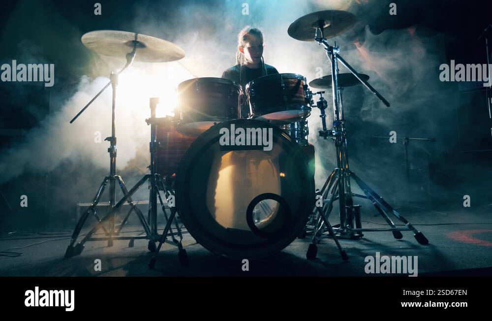 Male drummer is playing the drum kit in the shadows and smoke Stock ...