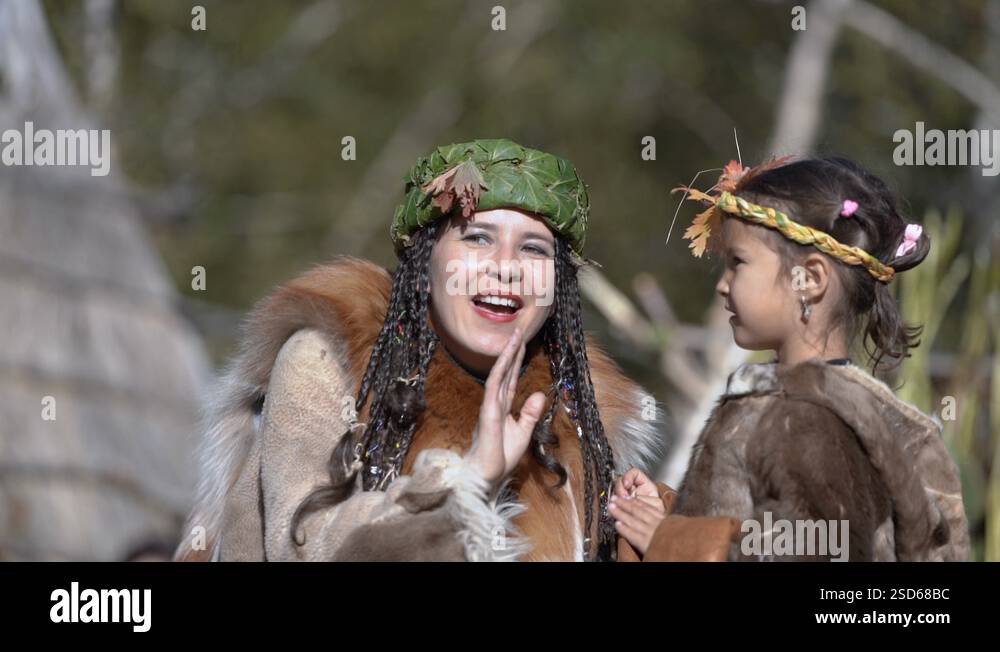 Mother and daughter dancing in traditional clothing of aboriginal ...