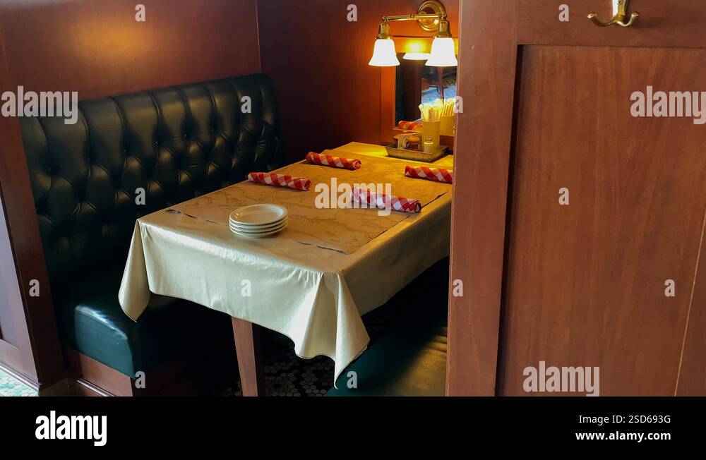 A moving shot of a four person booth, set up and ready for customers ...