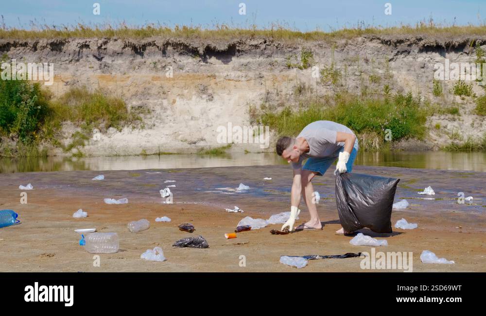 Angry man collects plastic trash on banks of polluted river, then drops ...