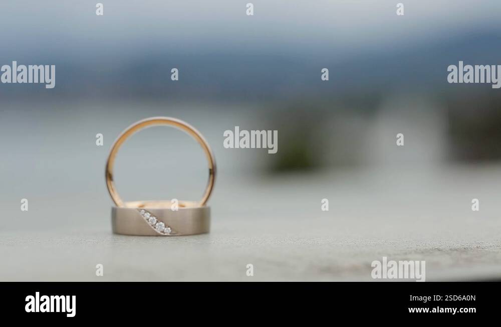 Macro shooting of gold wedding rings on blurred nature background Stock ...