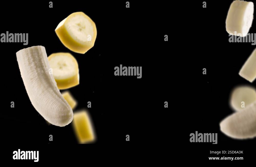 Flying of Banana and Slices in Black Background Stock Video Footage - Alamy