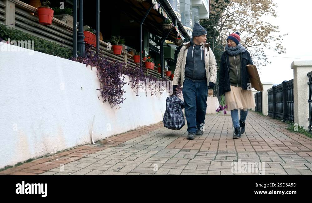 a couple of homeless man and a woman walk in a city park Stock Video ...