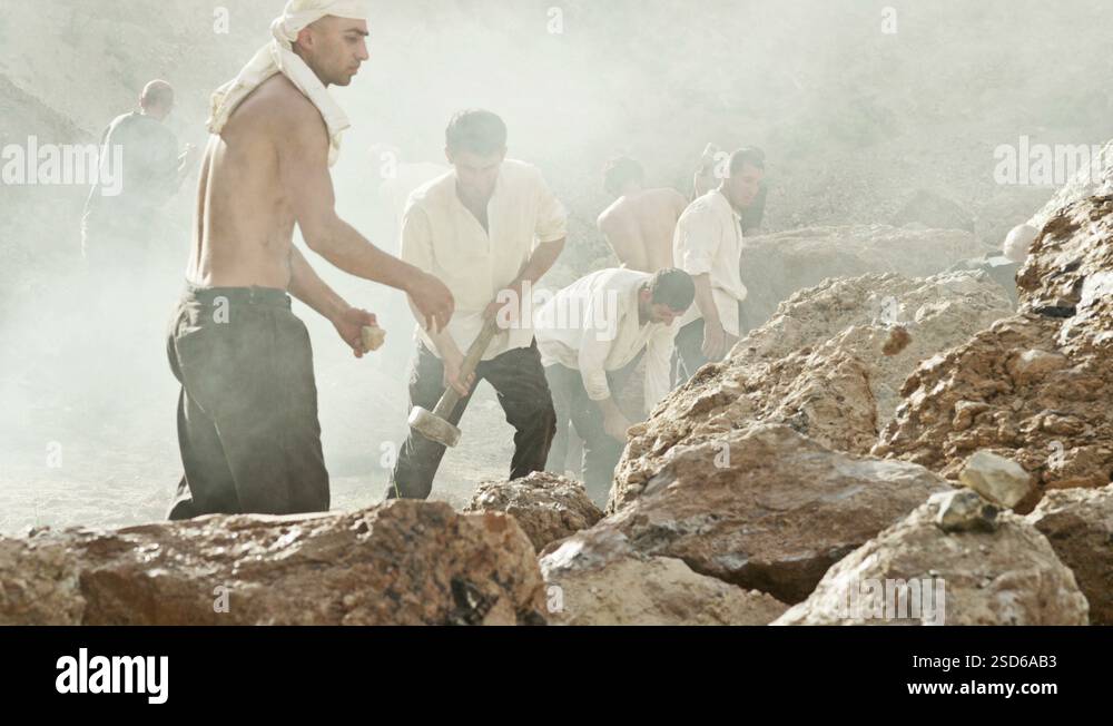 A group of miners or gold diggers working . Many workers mining in a ...