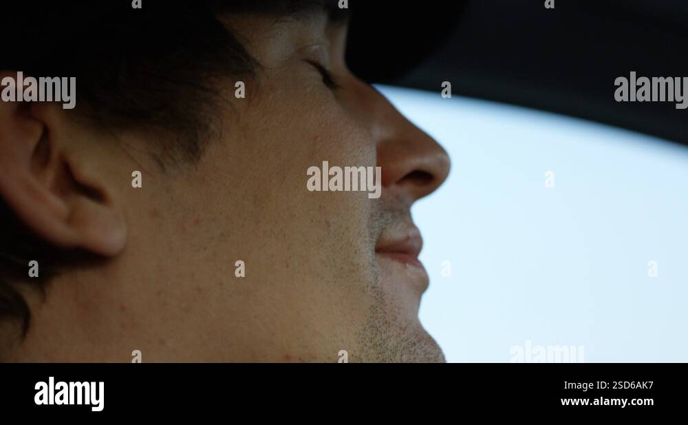 Man driving car - extreme close up on face as he closes eyes - tired ...