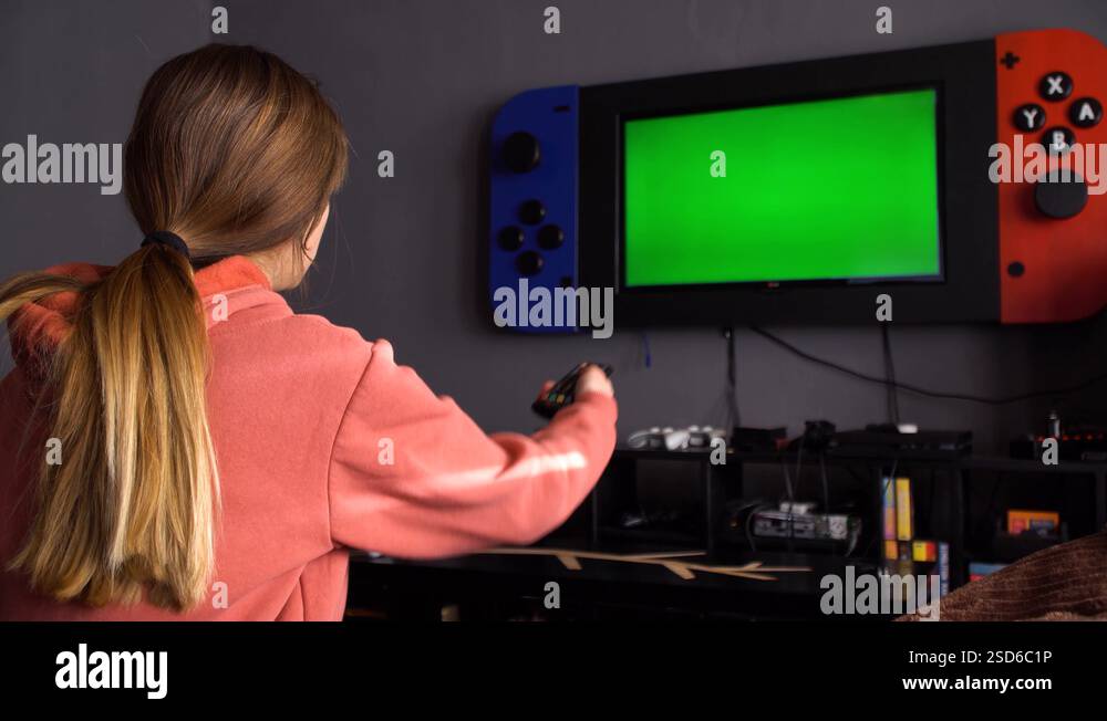 Young girl switches channels. Green screen on TV Stock Video Footage ...
