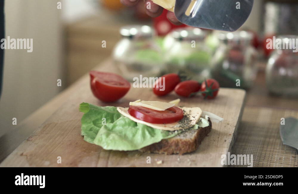 Yellow cheese falling on sandwich, slow motion shot at 240fps HD Stock ...