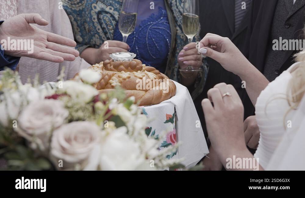 Newlyweds breaking traditional wedding bread at celebration Stock Video ...
