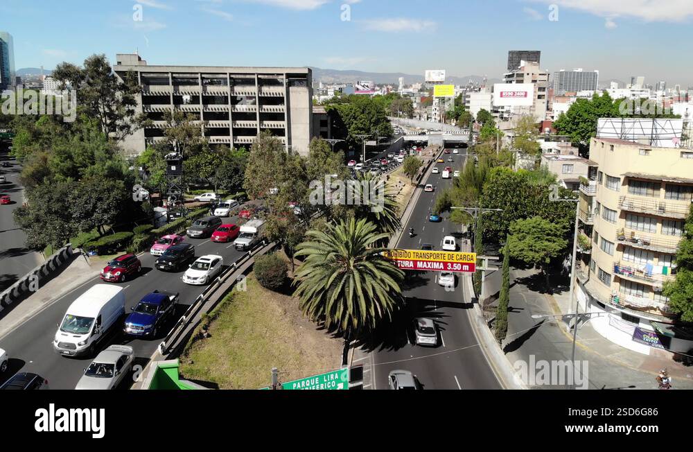 Revealing the skyline in Mexico City starting on a highway with heavy ...