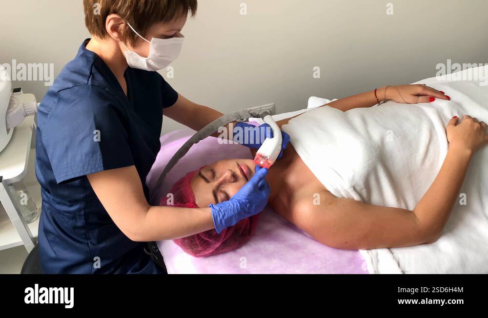Woman getting LPG hardware massage at the beauty clinic. Professional ...