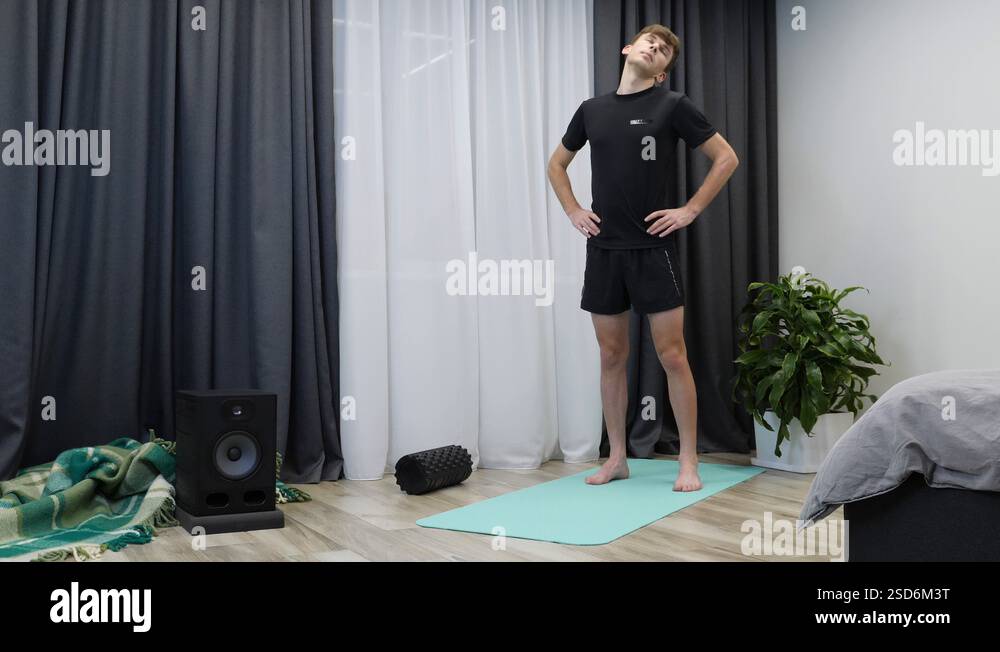 Male does physical exercise at home. Athletic fit boy doing fitness and ...