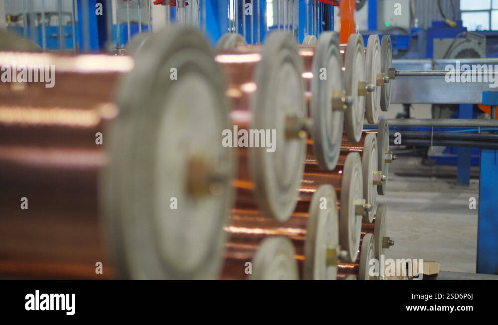 Copper wire winding on coils on industrial machines at factory Stock ...