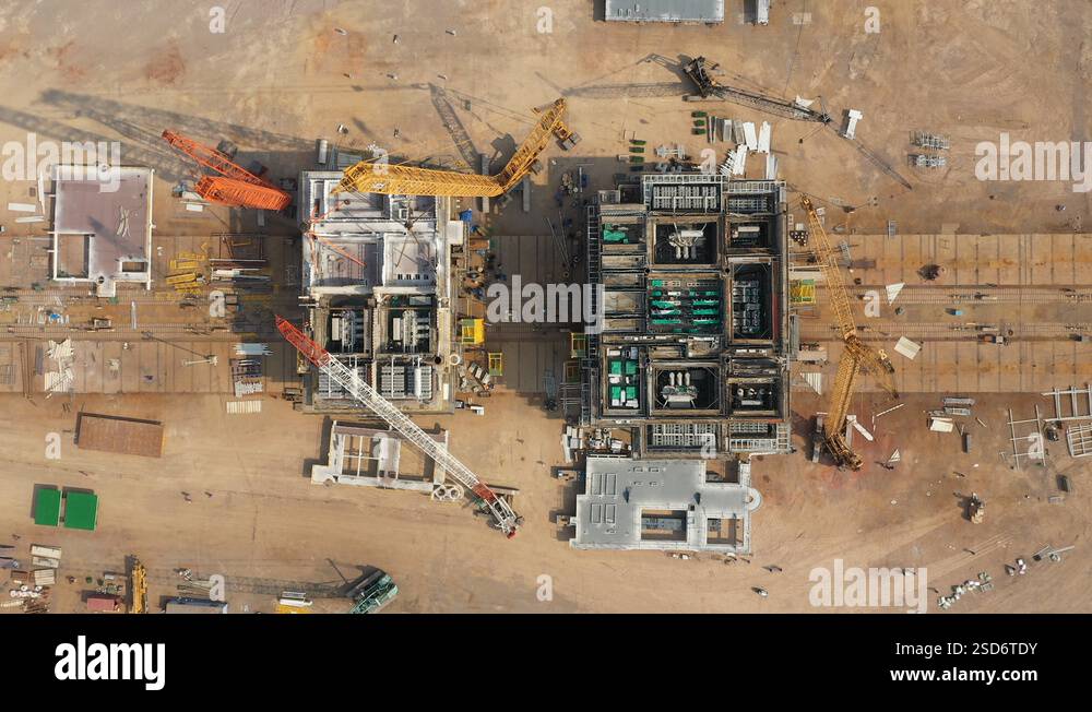Bird's eye perspective of oil rigs under construction at shipyard in ...
