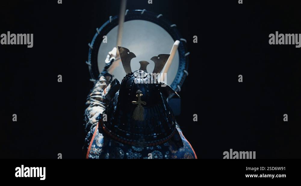 Japanese man in historical samurai costume playing on taiko drum with ...