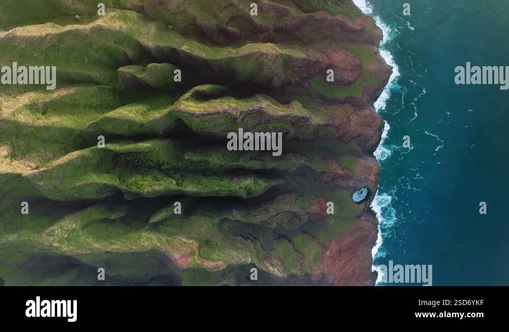 Sharp ridges and narrow gorges of hawaiian coastline, washed by blue ...