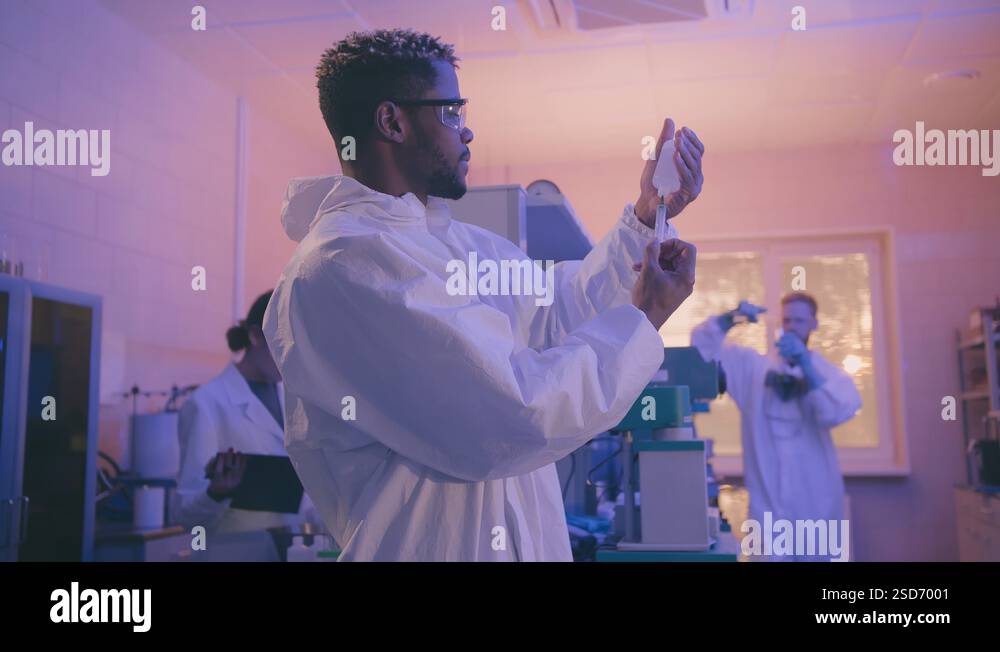 African-american scientist or graduate student in lab coat and ...