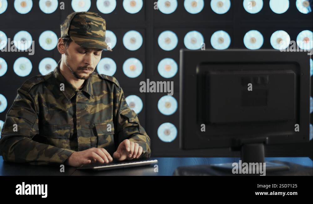 Serious-looking adult caucasian male in military clothes types on ...