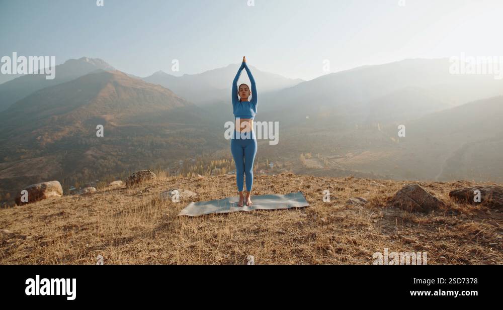 Yoga meditation in mountains. Fit girl doing yoga poses, having ...