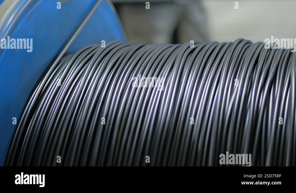 Winding cable on a rotating coil. Production of electric cable Stock ...