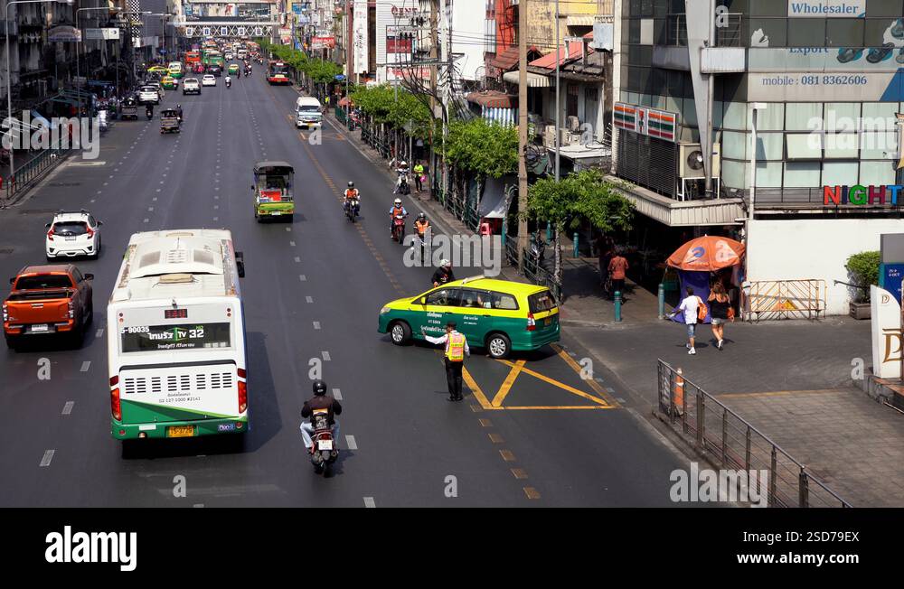 Traffic controller A man in a special vest, regulates the movement of ...