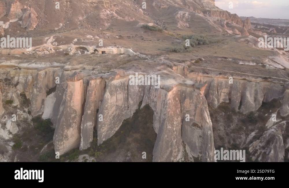 Huge cliffs on the side of the mountain with some caves, Cappadocia ...