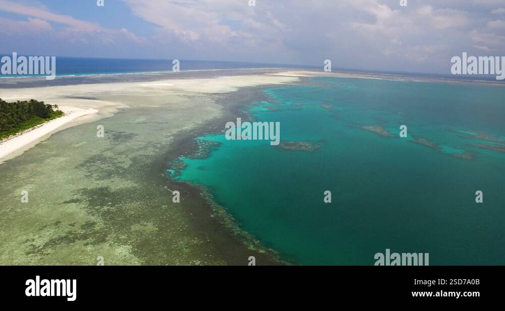 Aerial view of the coral reefs of the Seychelles islands with turquoise ...