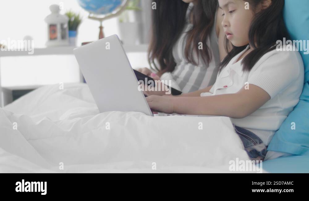 Asian girls and sisters are using laptops, computers and tablets Stock ...