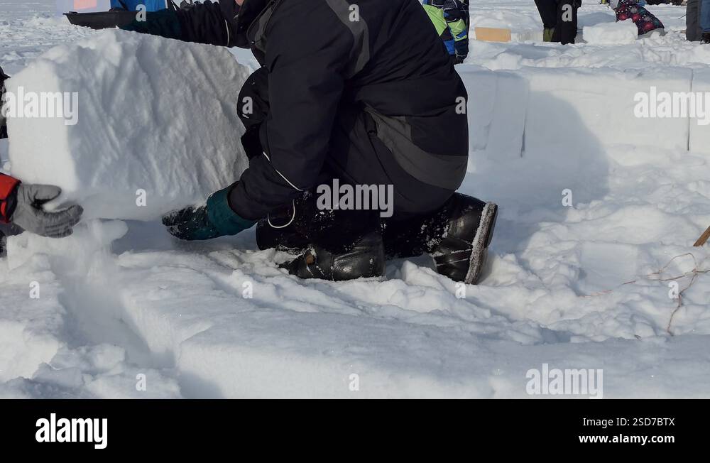 Igloo. People build an Igloo out of snow blocks Stock Video Footage - Alamy