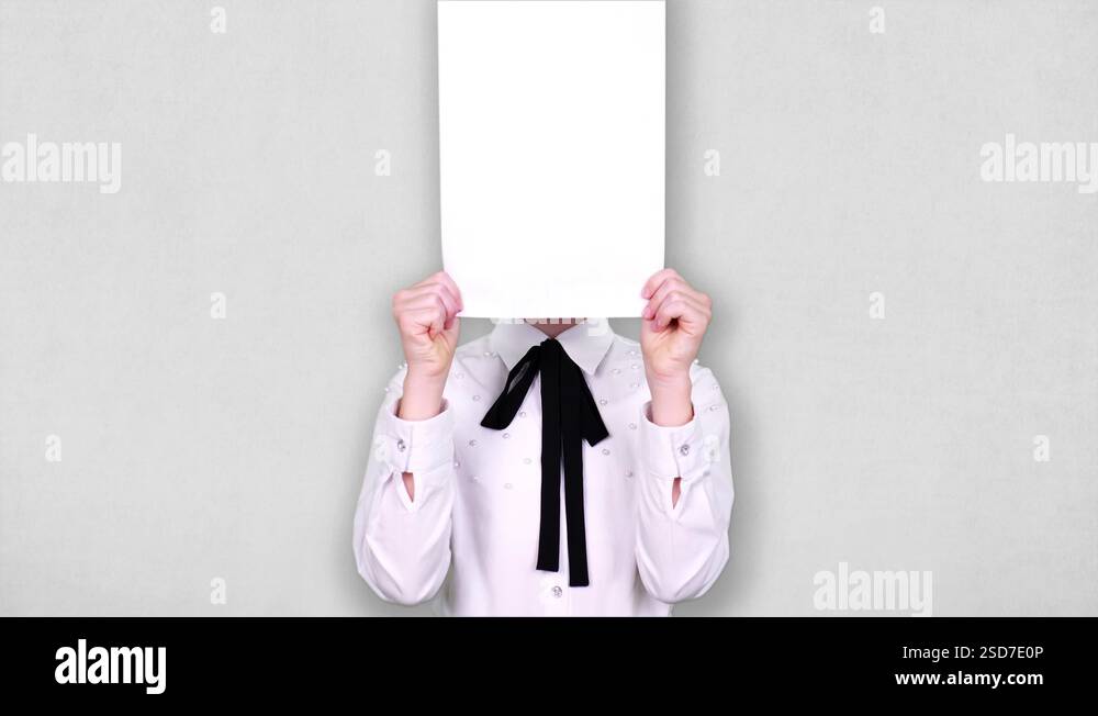portrait, teenager holds white paper sheet with crying smiley drawing ...