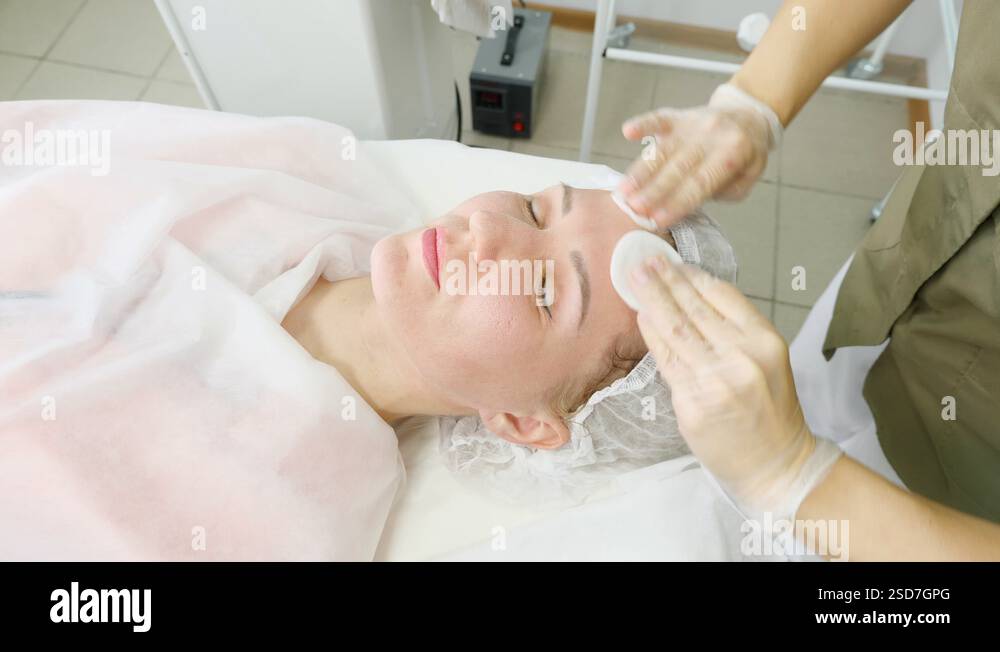 therapist in white sterile gloves rinses patient face close Stock Video ...