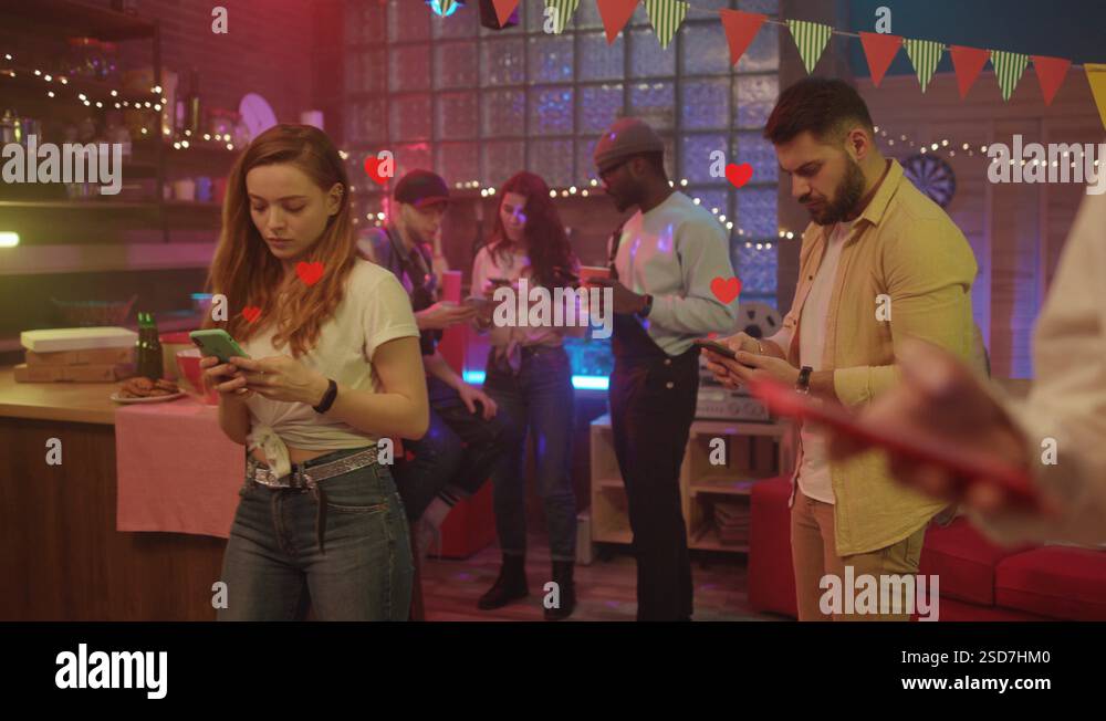 Company of multi-ethnic adult friends dancing at neon retro party and ...