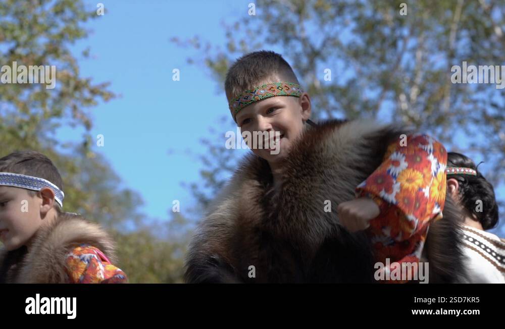 Boy dancing in traditional clothing of aboriginal people Kamchatka ...