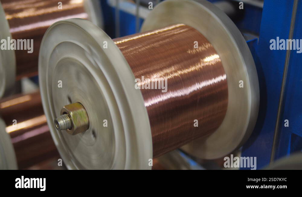 The process of drawing copper wires in the cable plant. Coil with ...
