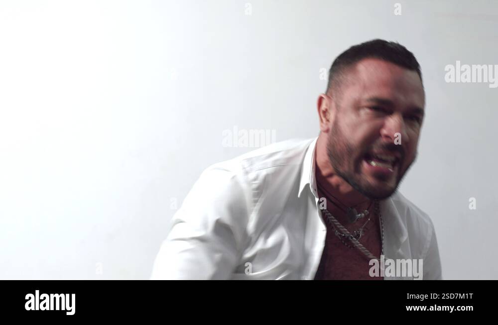 Man screaming very angry and aggressive. Stressed young man screaming ...
