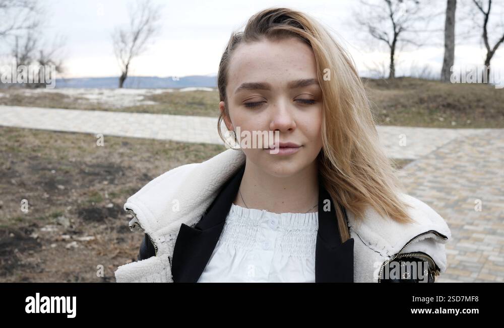 Woman shows disapproval sign, gives thumb down gesture, dislikes ...