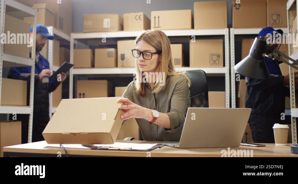 Beautiful Caucasian woman post worker sitting at desk and working at ...