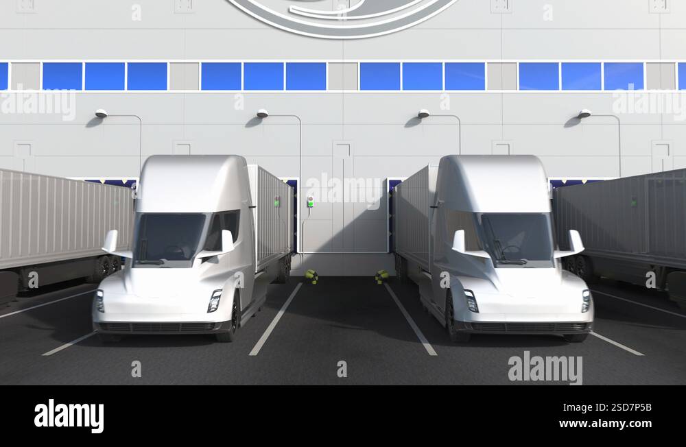 Electric semi-trailer trucks at warehouse loading bay with GENERAL ...