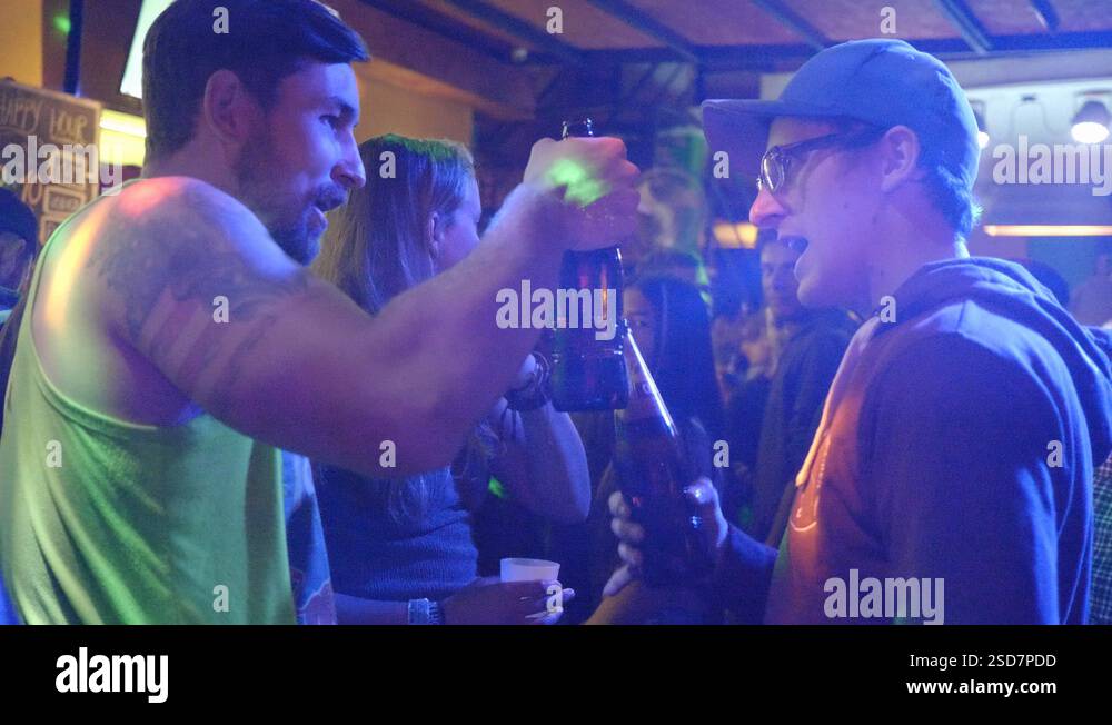 Happy people dance in nightclub DJ party concert and listen to ...