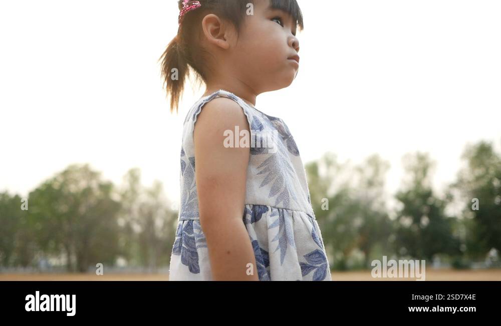 Upset little daughter feel hurt and avoid talking with mother trying to ...