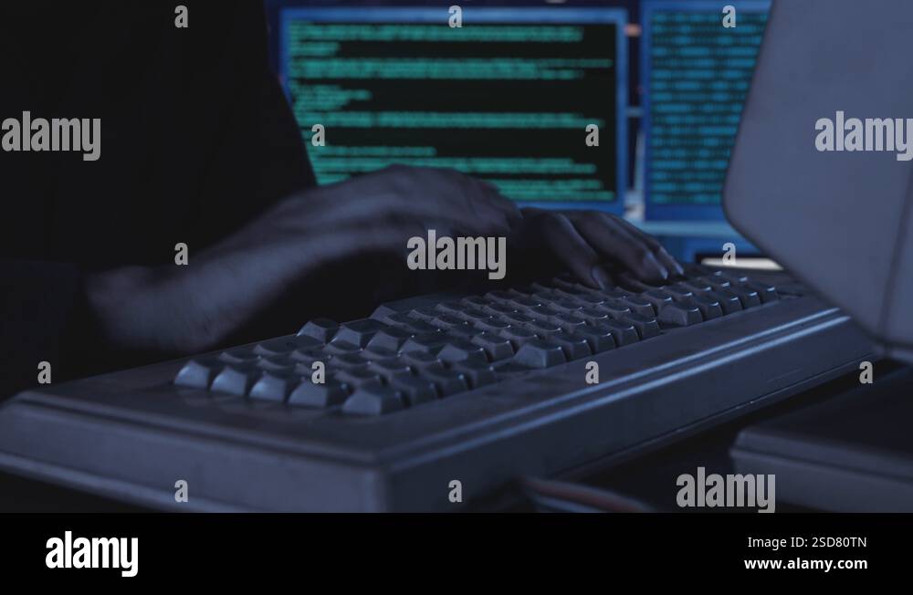 Man hands types on aged keyboard in server room Stock Video Footage - Alamy