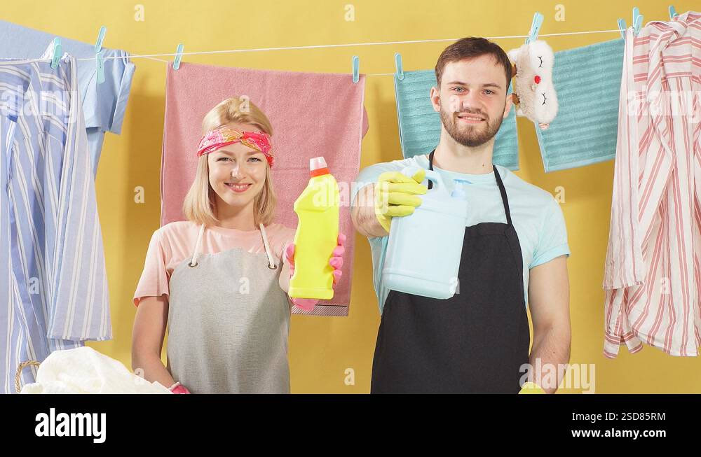 Young family has chosen washing liquid for dirty clothes with spots ...