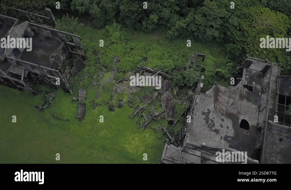 Orbiting aerial view of exploded ruins Corregidor Mike Long Barracks ...