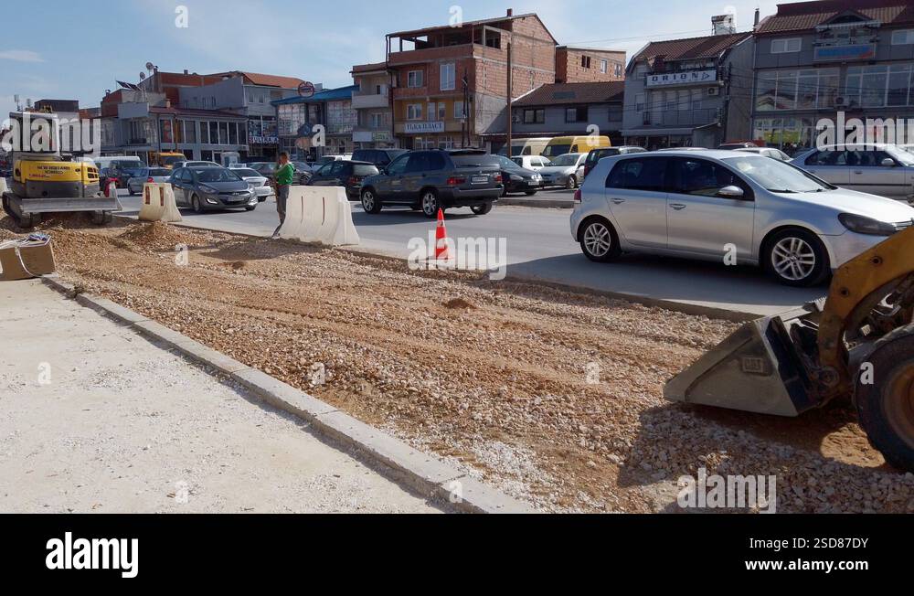 Excavators working on a street, building an extra lane.Road expansions ...