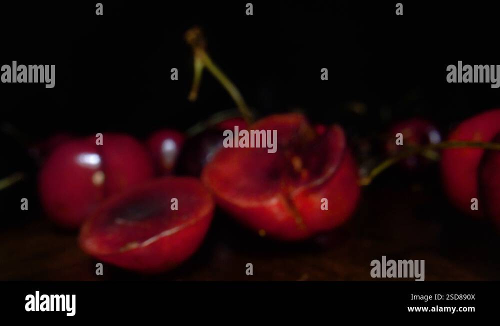 Cherries cutted in half macro zoom in shot. Camera dolly forward. RACK ...