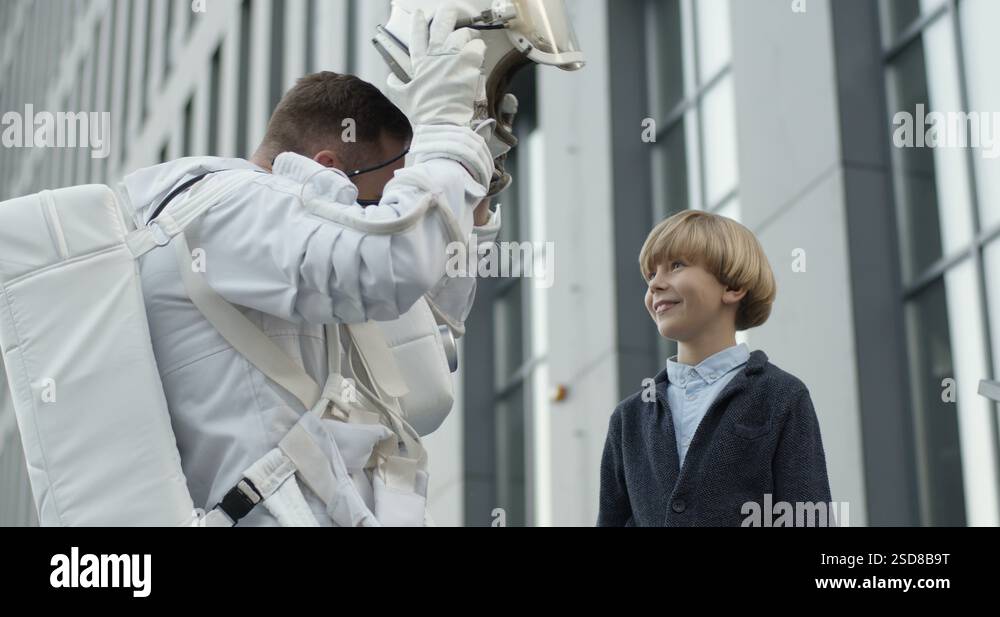 Spaceman father coming back home to his small cute son. Little ...